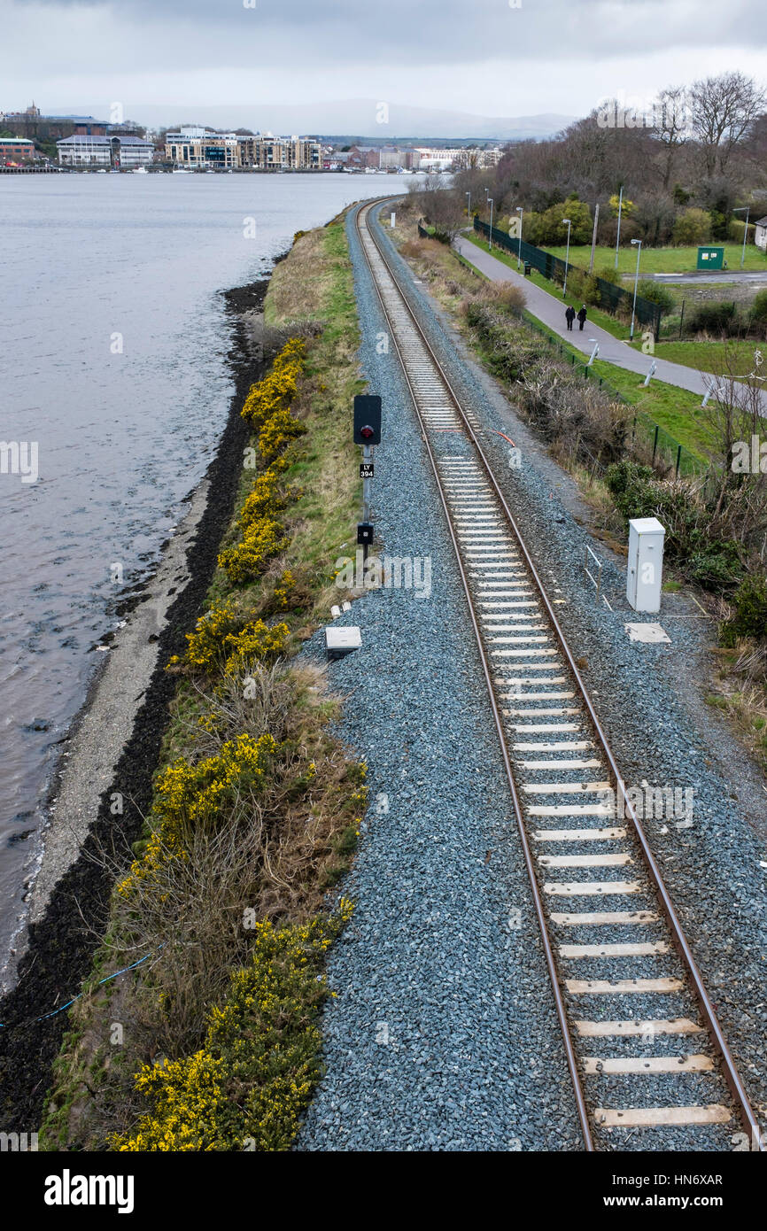 Railway line on the bank of the River Foyle, Derry, Northern Ireland ...