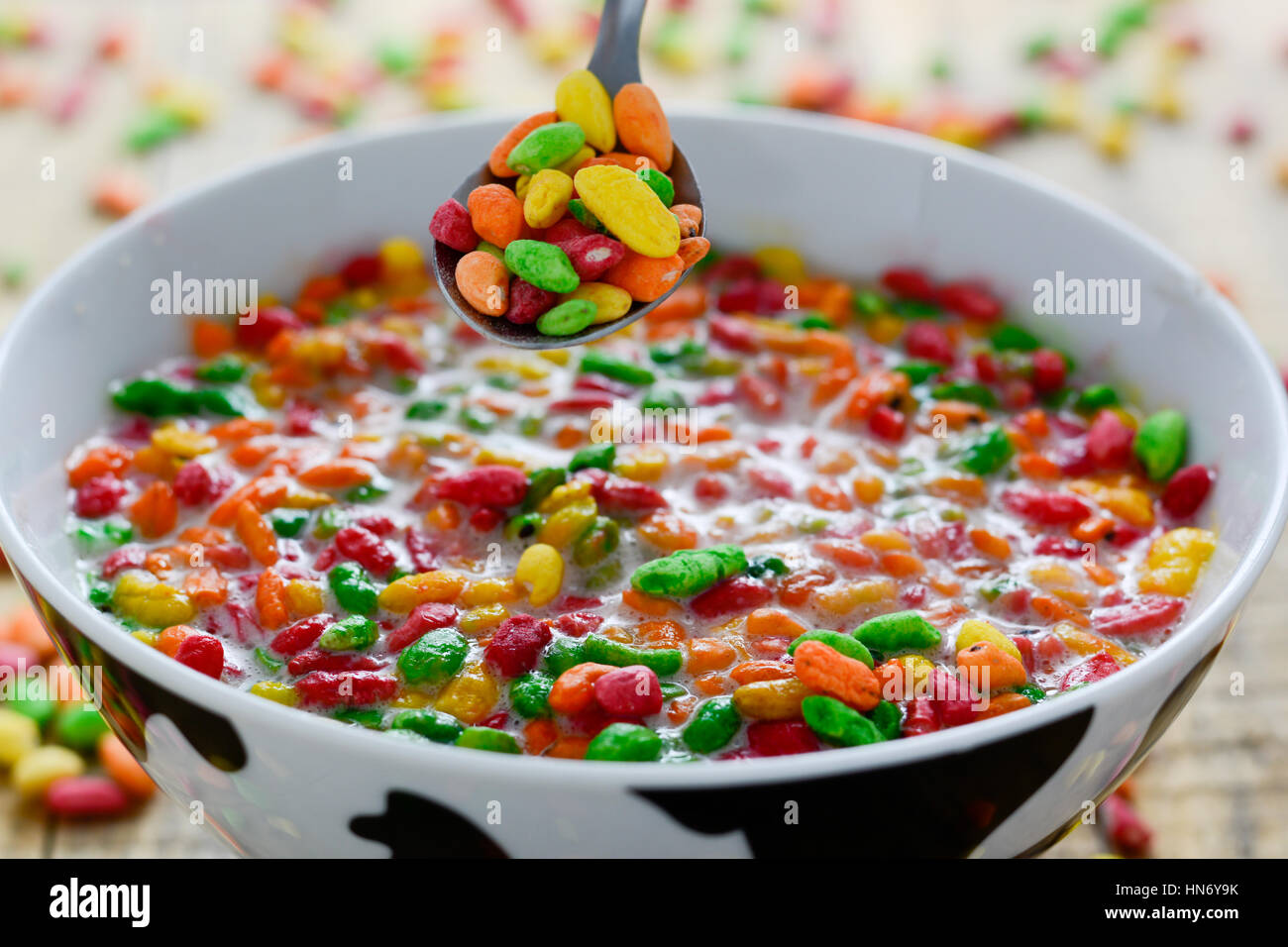 Prepared breakfast with colorful puffed rice with spilled rice in the ...