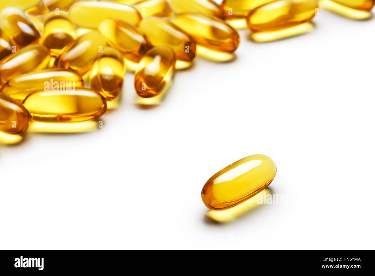 Pile of capsules Omega 3 on white background. Close up, high resolution ...