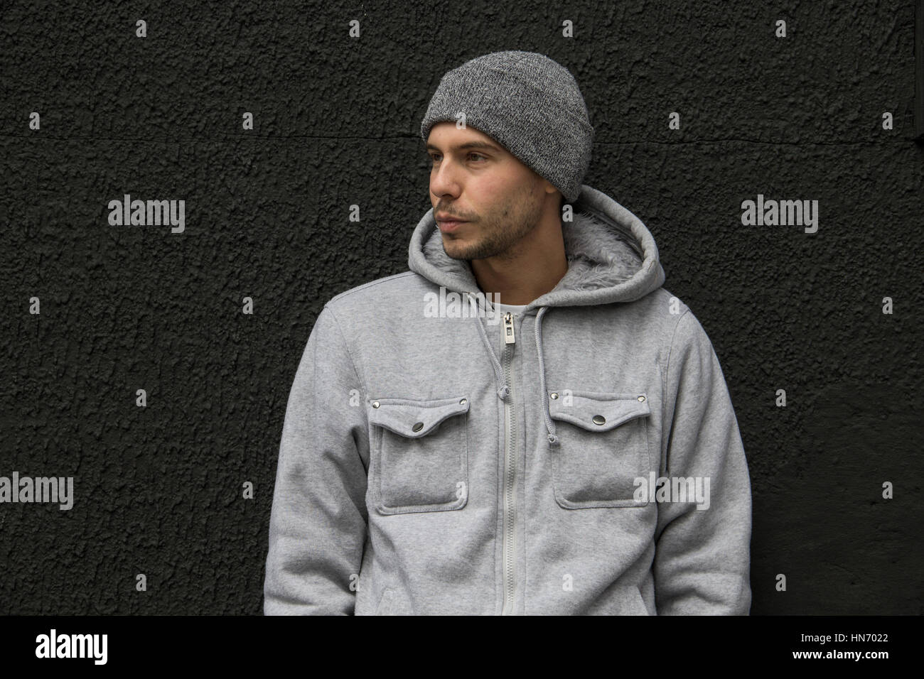 Profile Of A Young Man With A Grey Cap Looking Up Stock Photo - Alamy