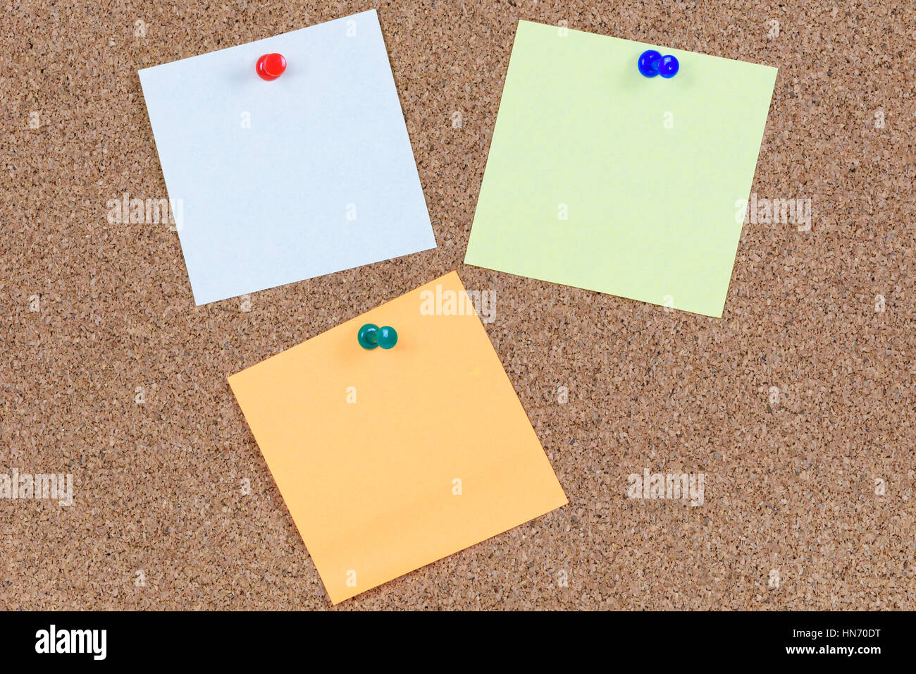 Various sticky notes on an office cork bulletin board Stock Photo - Alamy