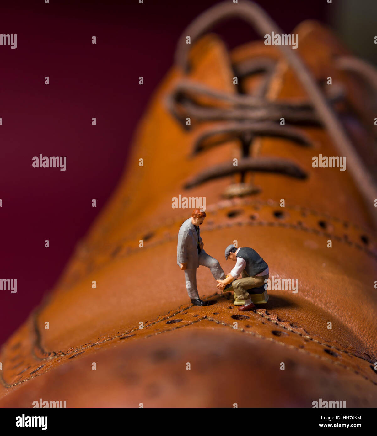 Miniature Figures shoeshine scene on a Mans brown Brogue shoe Stock ...