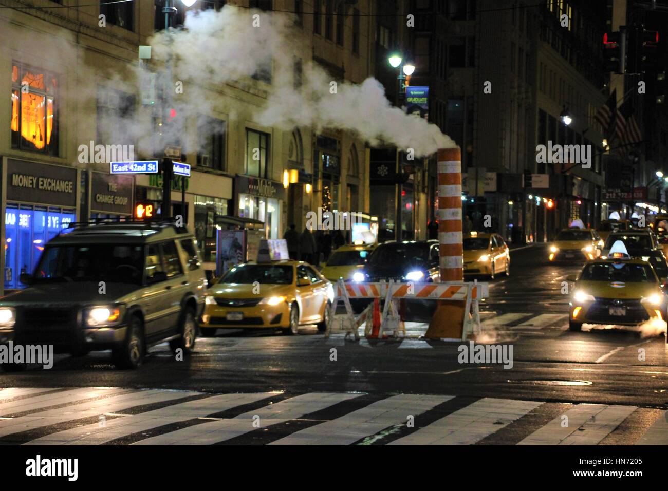 Steam vapor vented through a typical Con Edison orange and white steam ...