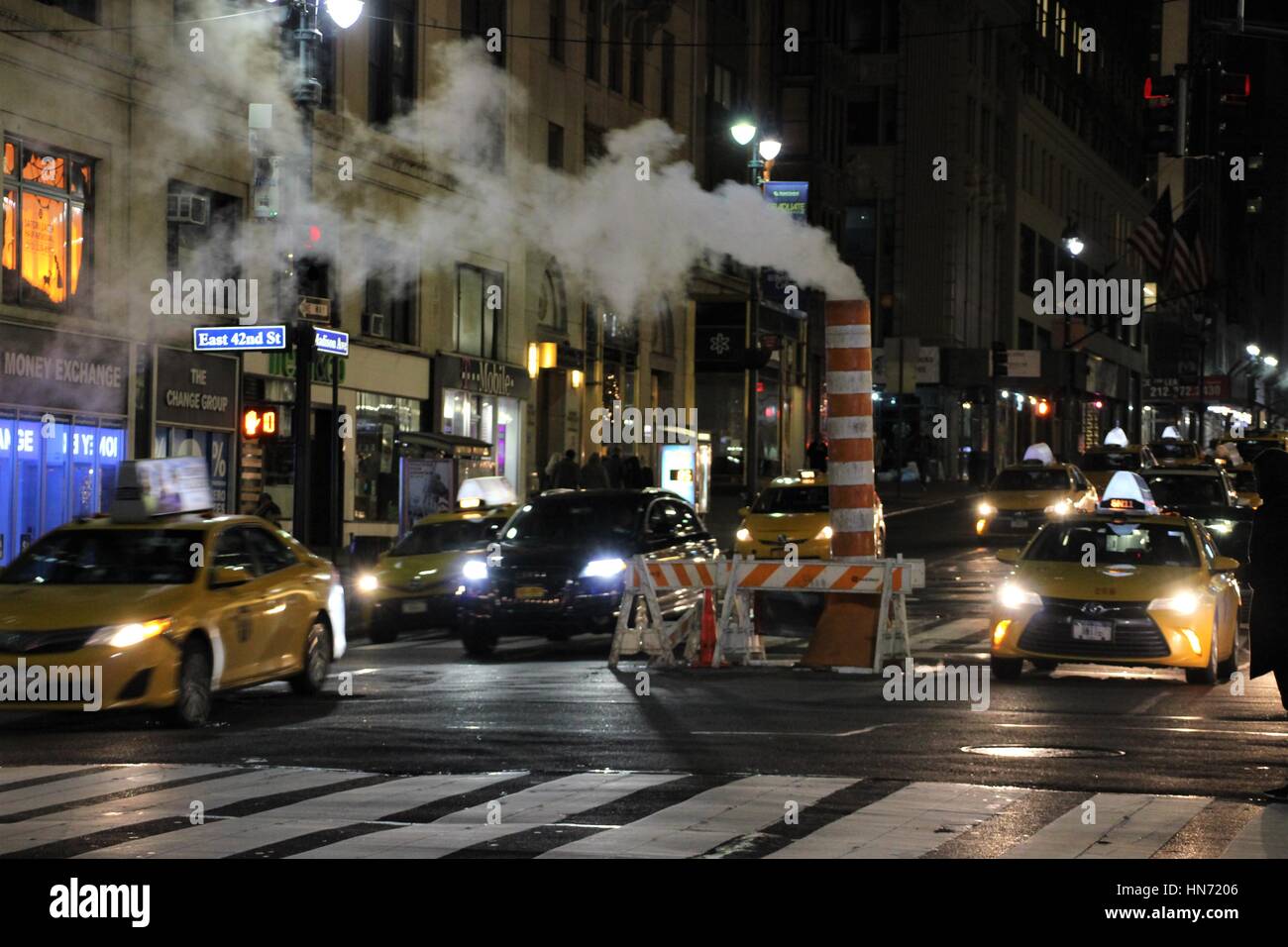 Steam vapor vented through a typical Con Edison orange and white steam ...