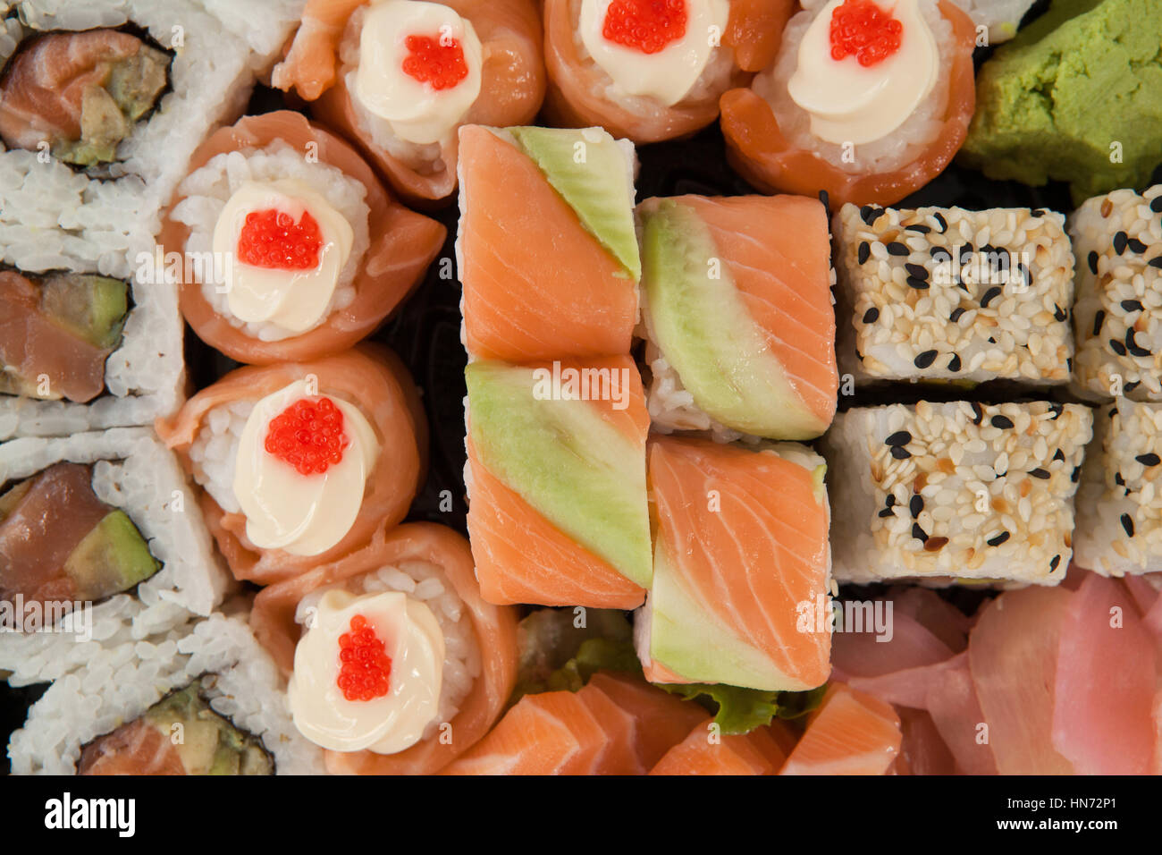 Close-up of assorted sushi set served in white box against white ...