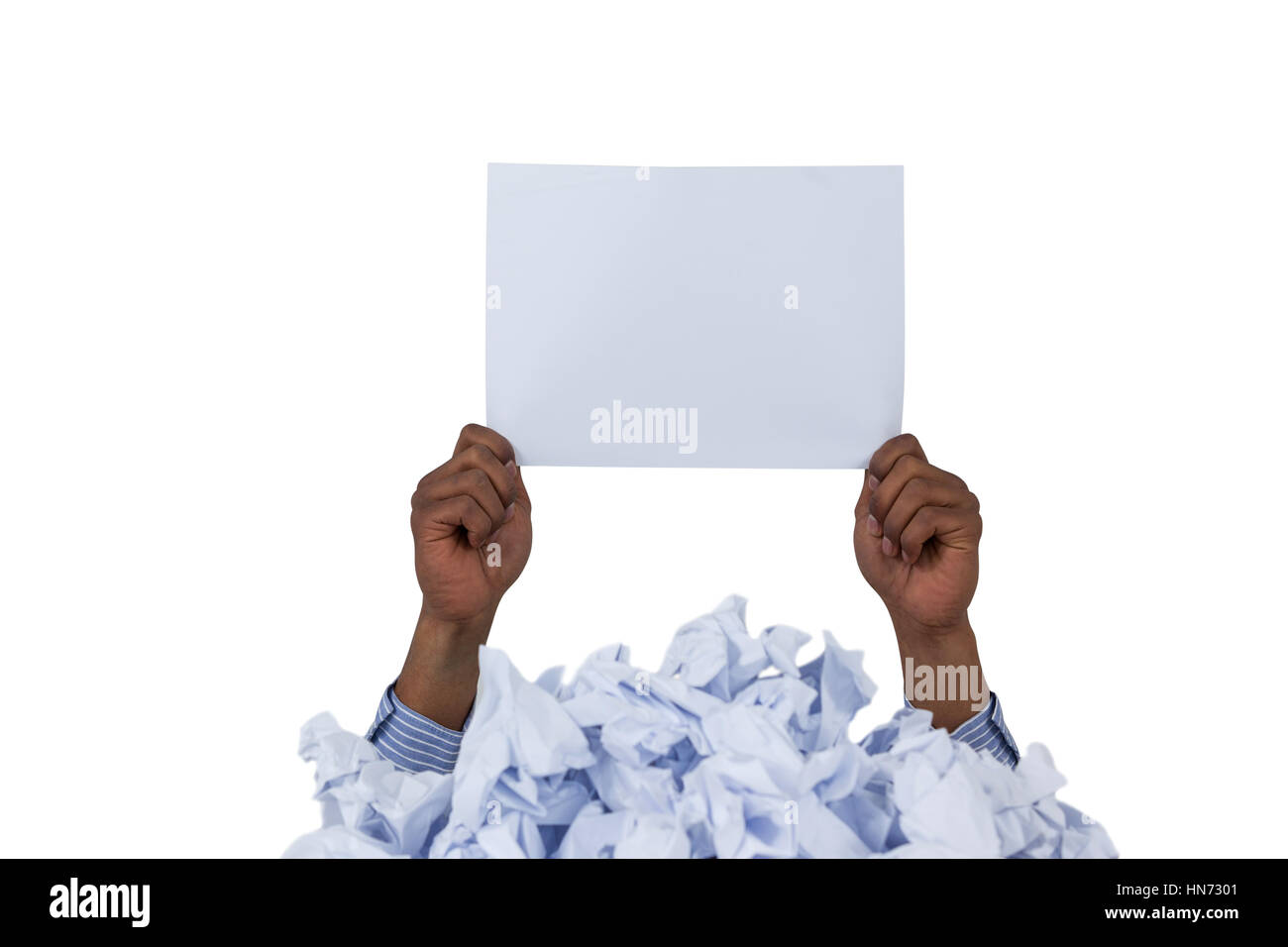 Heap of crumpled paper with hand holding blank page on white background ...