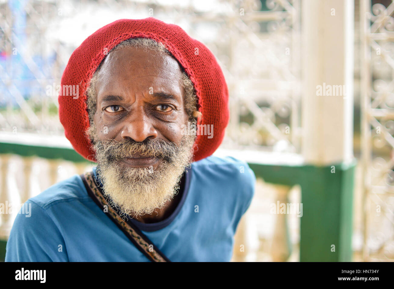 Bluefields, Nicaragua - July 15, 2015: Elderly rasta man wears a red ...