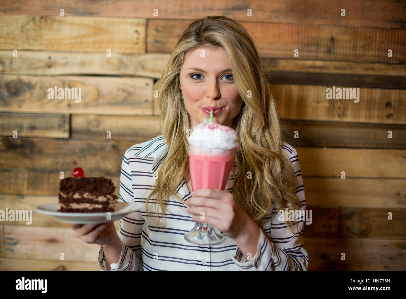 Woman sipping milkshake hi-res stock photography and images - Alamy