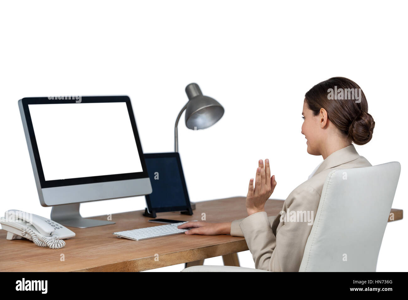 Businesswoman working over computer against white background Stock ...