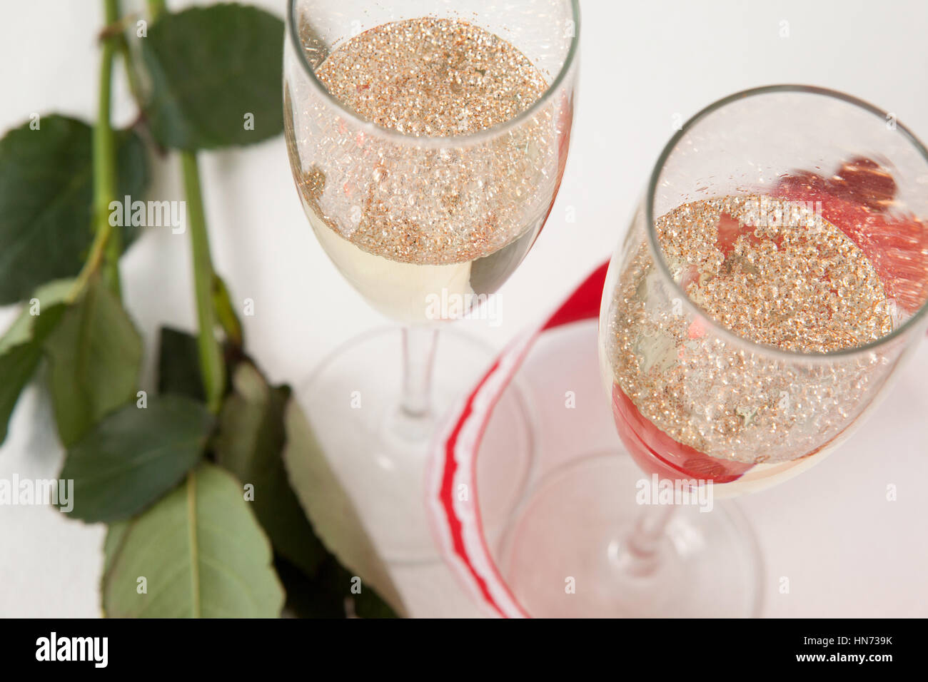 Close-up of champagne glass against white background Stock Photo - Alamy