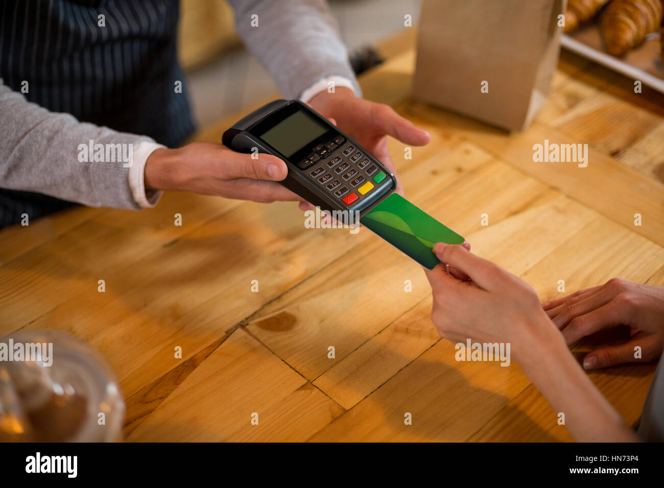Customer making payment through credit card at counter in cafÃƒÂ© Stock ...