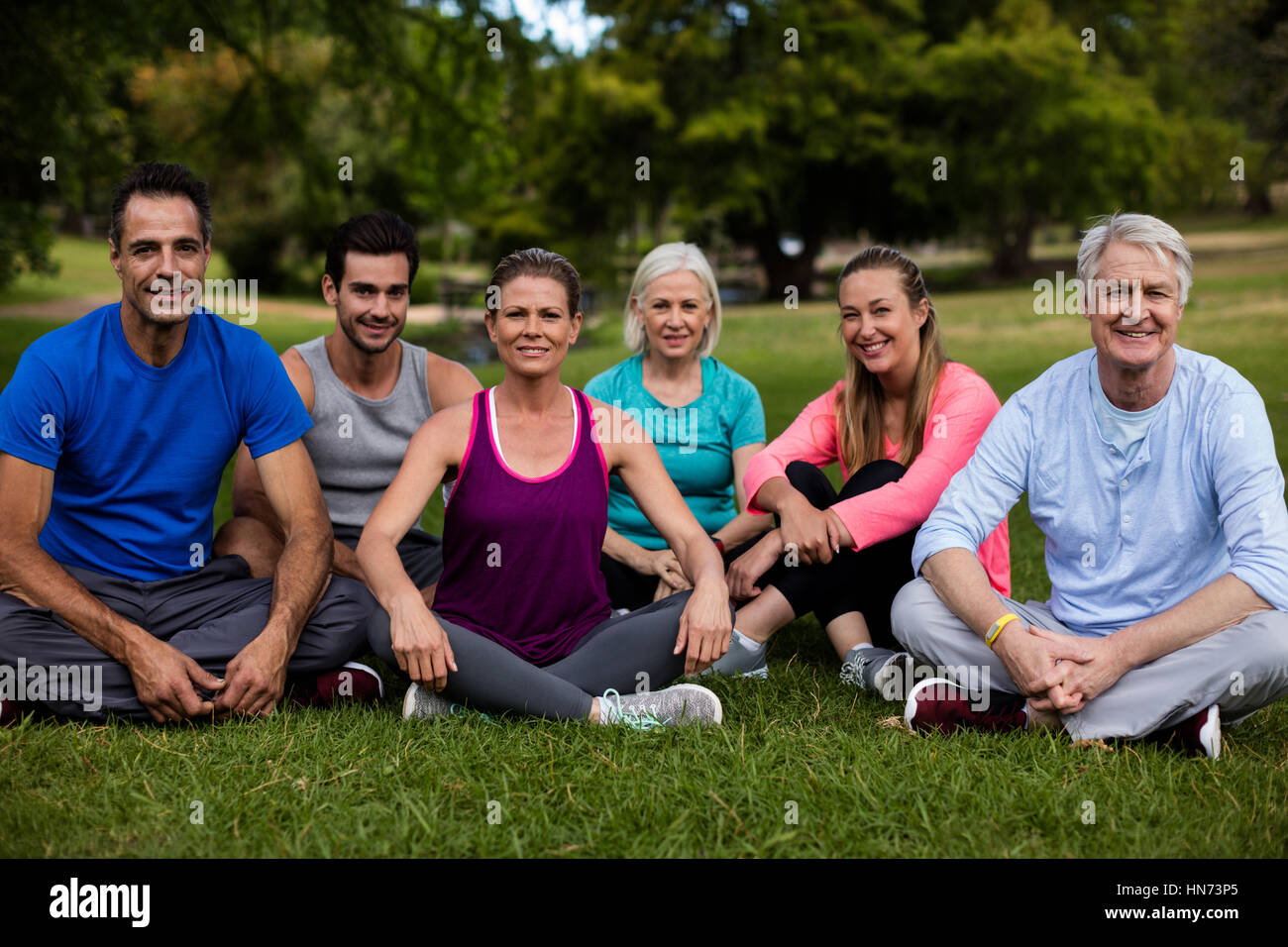 Group of people sitting together hi-res stock photography and images ...