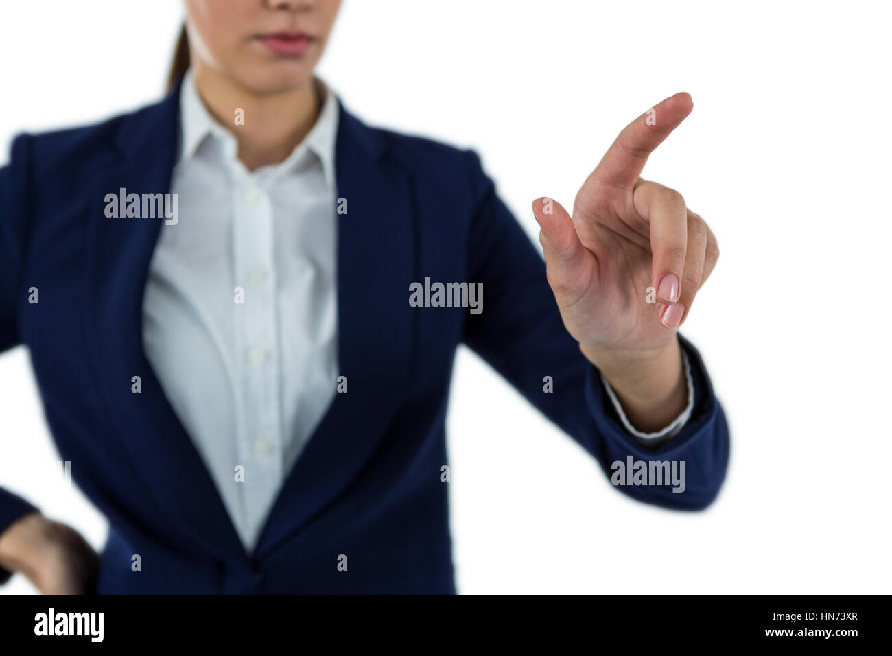 Mid section of businesswoman using invisible screen against white ...