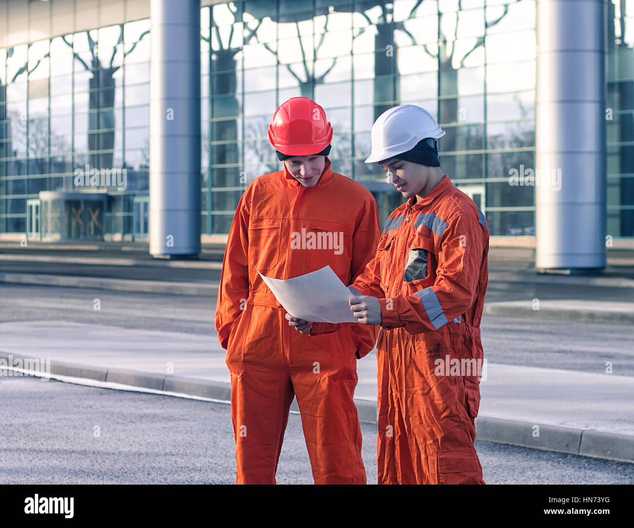 team of young engineers discussing a construction project. The wear ...