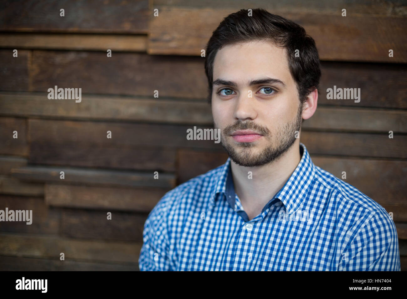 Portrait of confident business executive standing in office Stock Photo ...