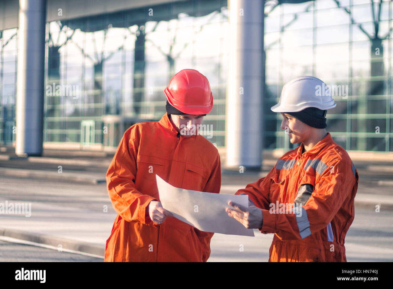 team of young engineers discussing a construction project. The wear ...
