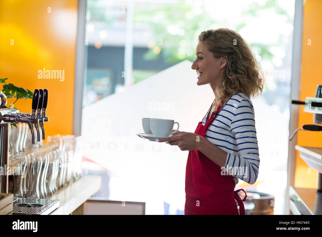 Pretty blonde waitress serving hi-res stock photography and images - Alamy