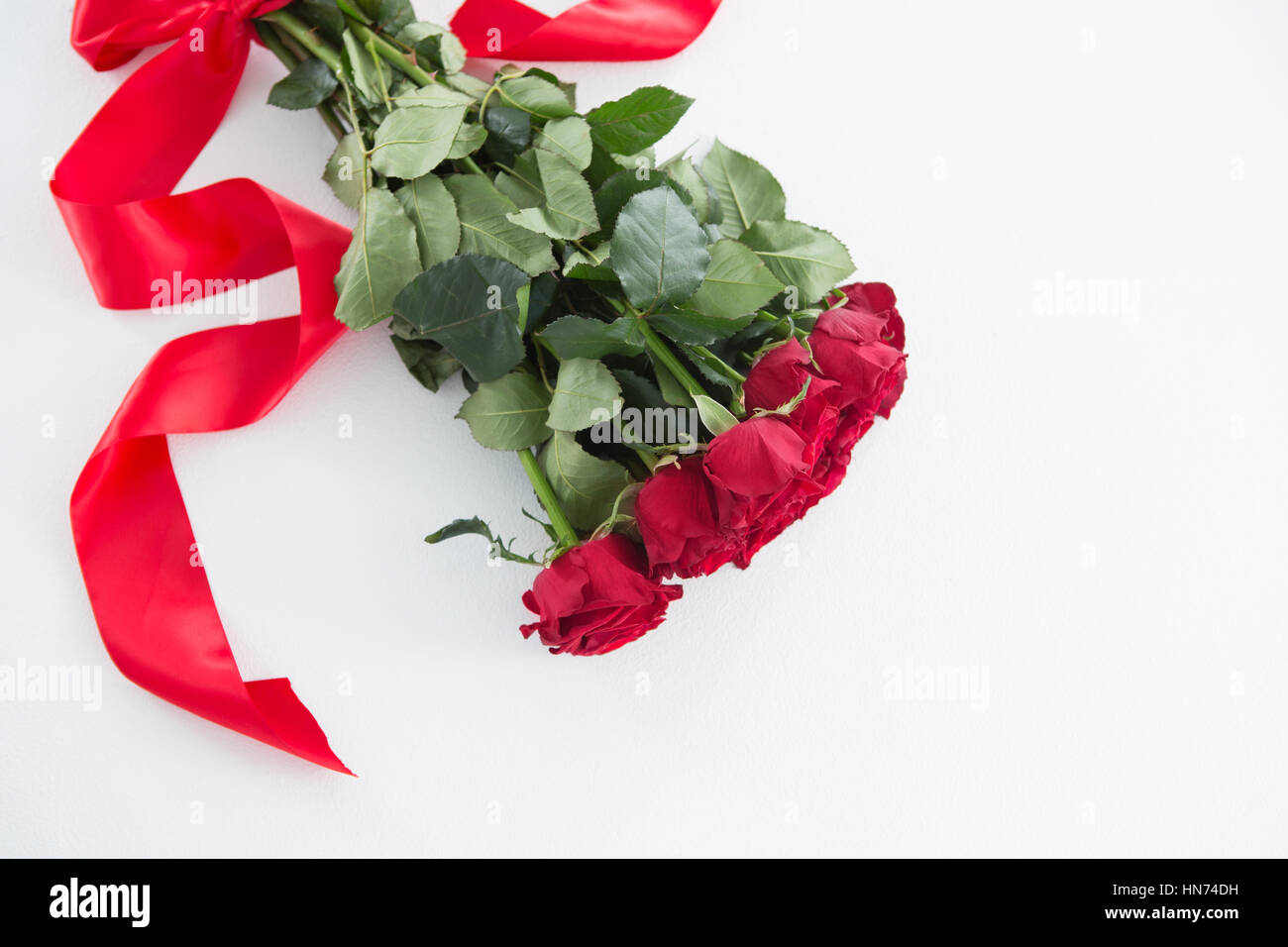 Bunch of red roses on white background Stock Photo - Alamy