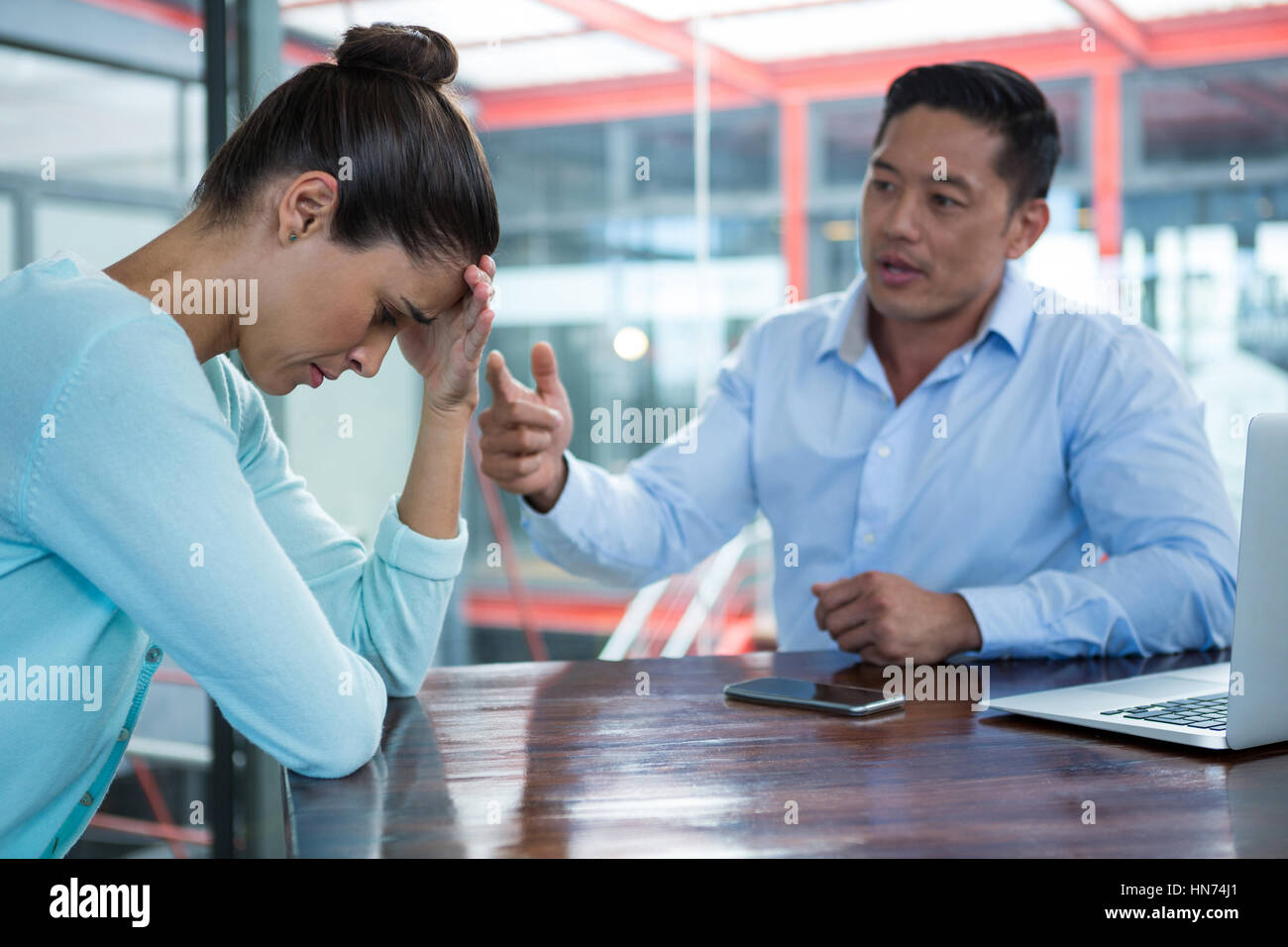 Businessman arguing with a colleague in office Stock Photo - Alamy