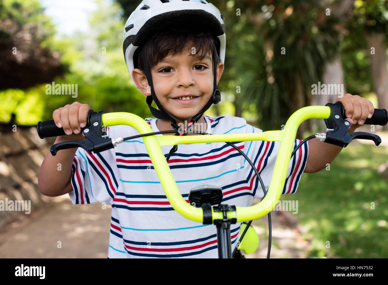 Boy standing with bicycle hi-res stock photography and images - Alamy