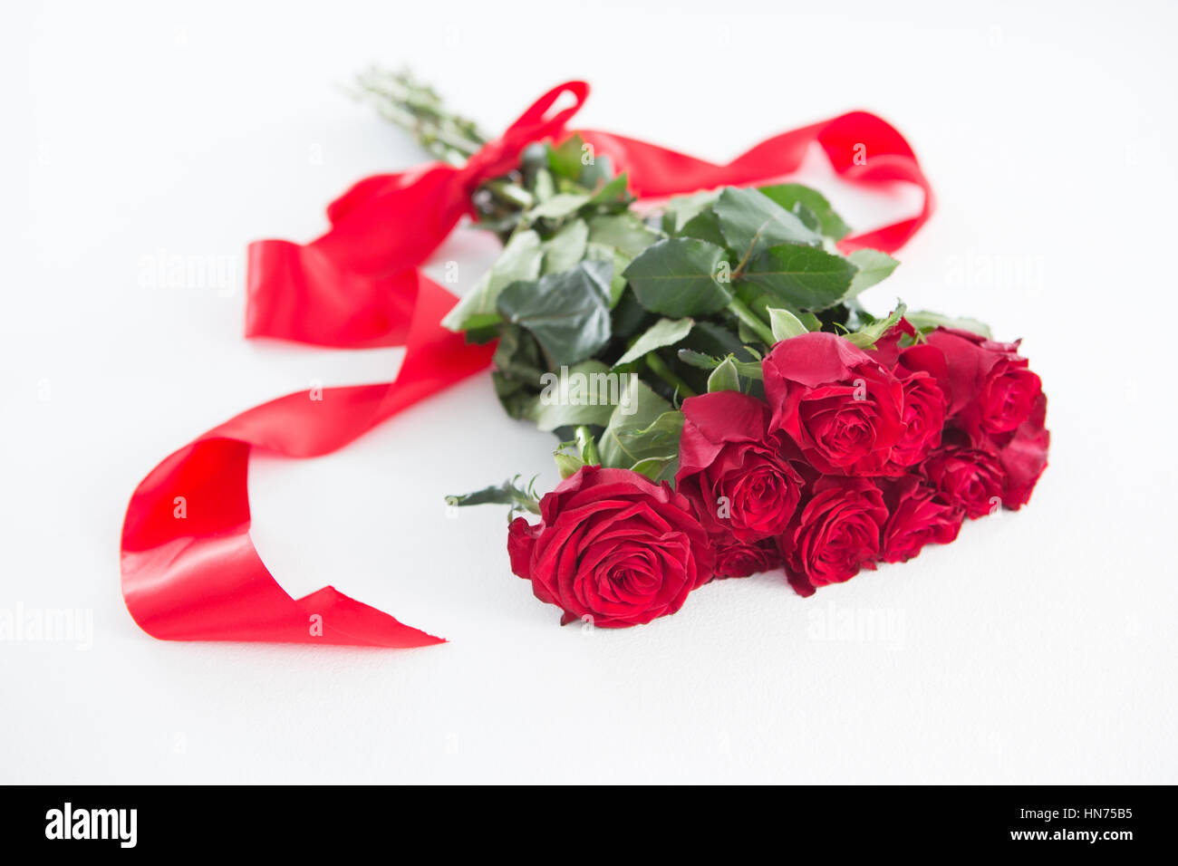 Bunch of red roses on white background Stock Photo - Alamy