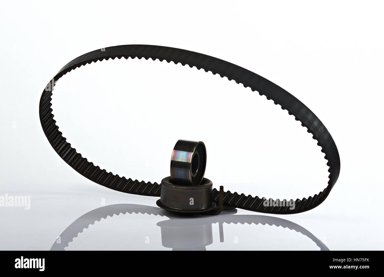 oval timing car belt with rollers isolated on white Stock Photo - Alamy