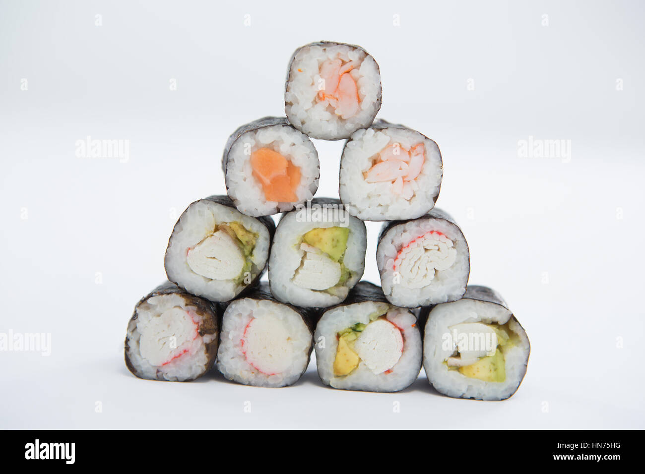 Stack of maki sushi arranged on white background Stock Photo - Alamy