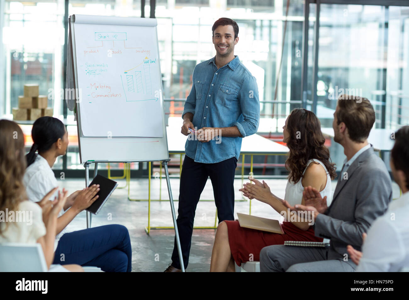 Business executives discussing over white board in office Stock Photo ...