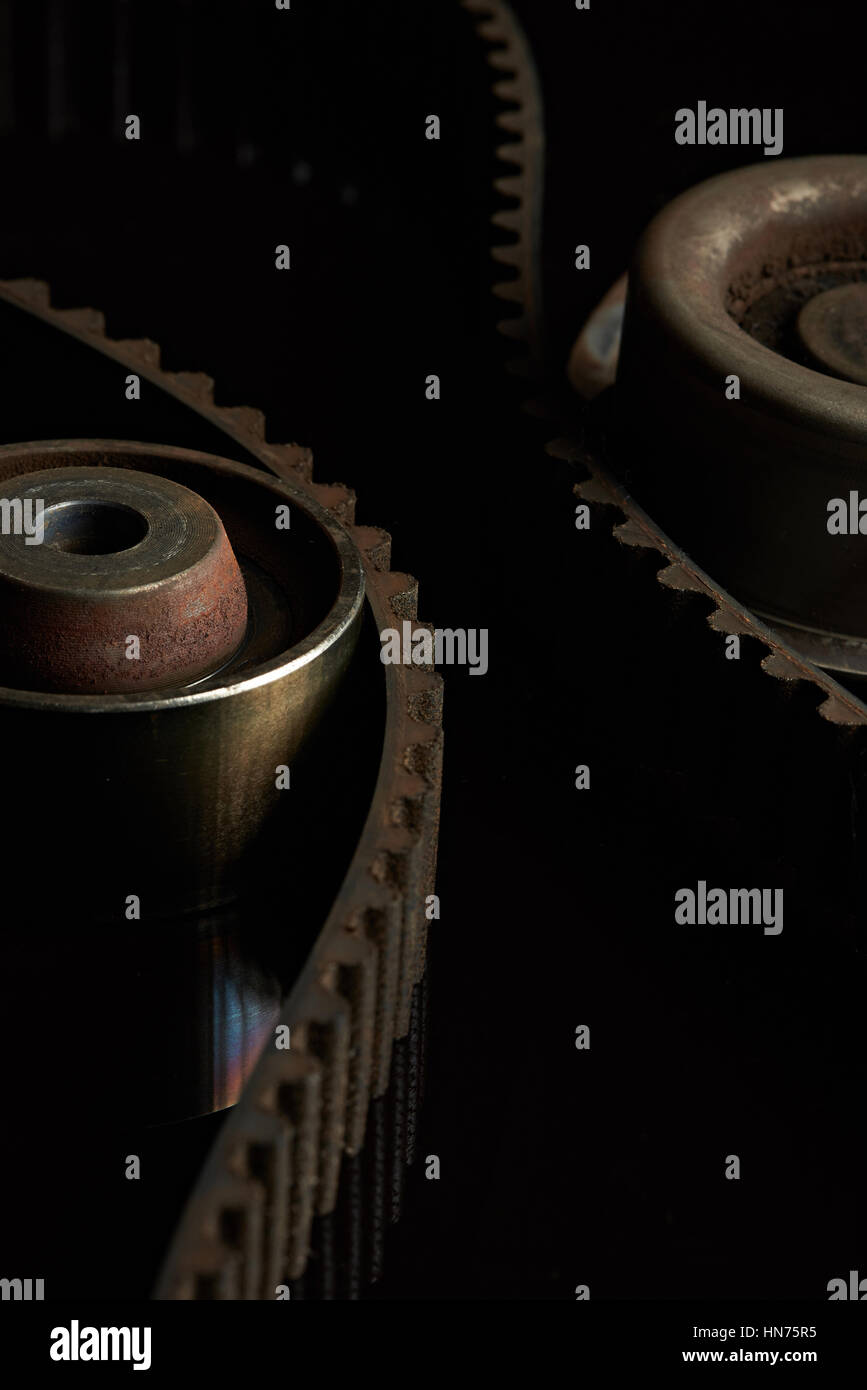 car spare part belt and roller on black background Stock Photo - Alamy