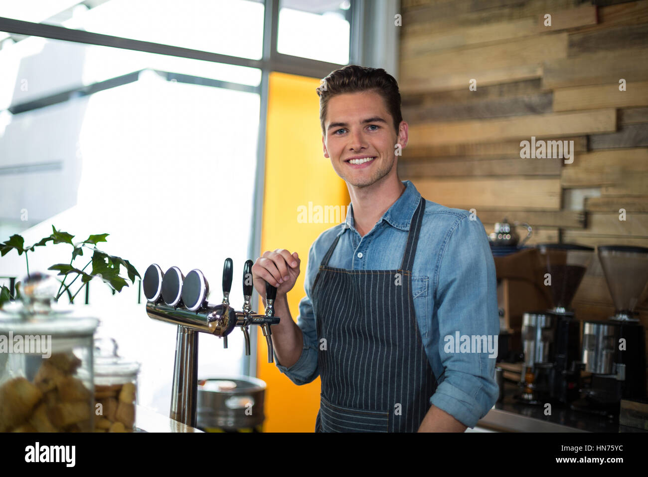 Portrait of smiling waiter standing at counter in cafÃƒÂ© Stock Photo ...