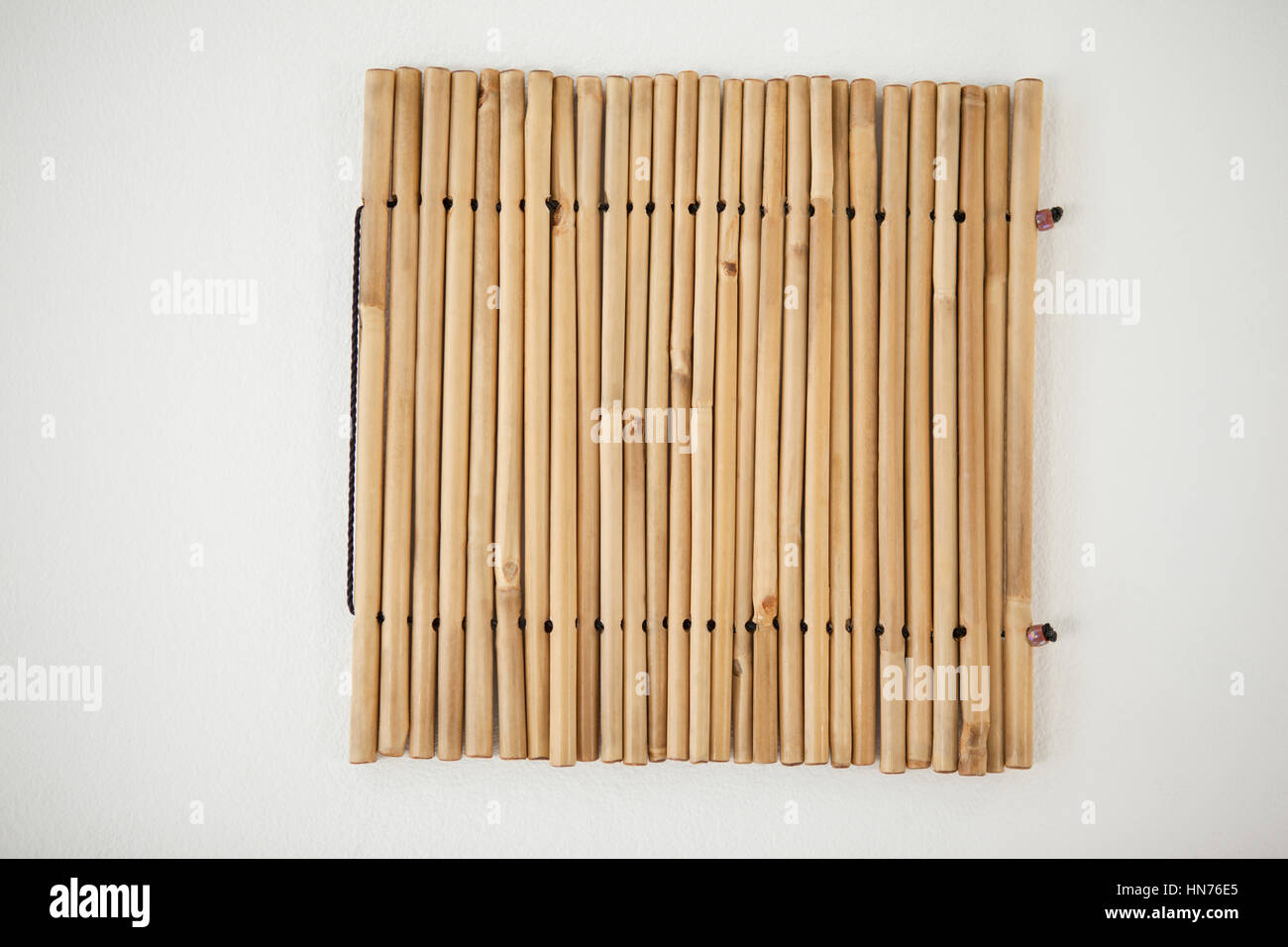 Straw sushi mat against white background Stock Photo - Alamy