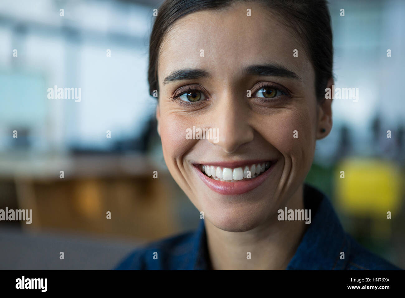 Portrait of smiling business woman in office Stock Photo - Alamy