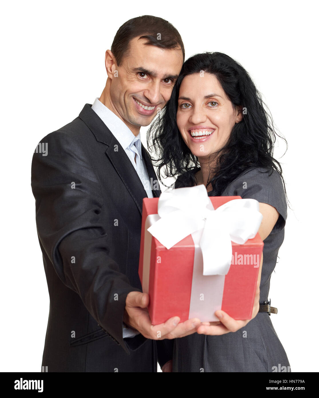 romantic couple with gift box, people dressed in black suit, man gives ...