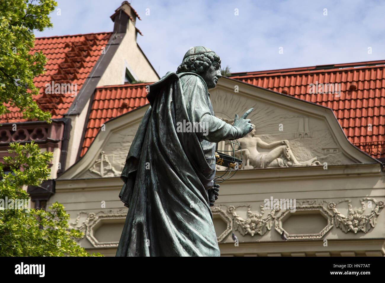 The statue of Copernicus and the old town in Torun, Thorn, Poland Stock ...