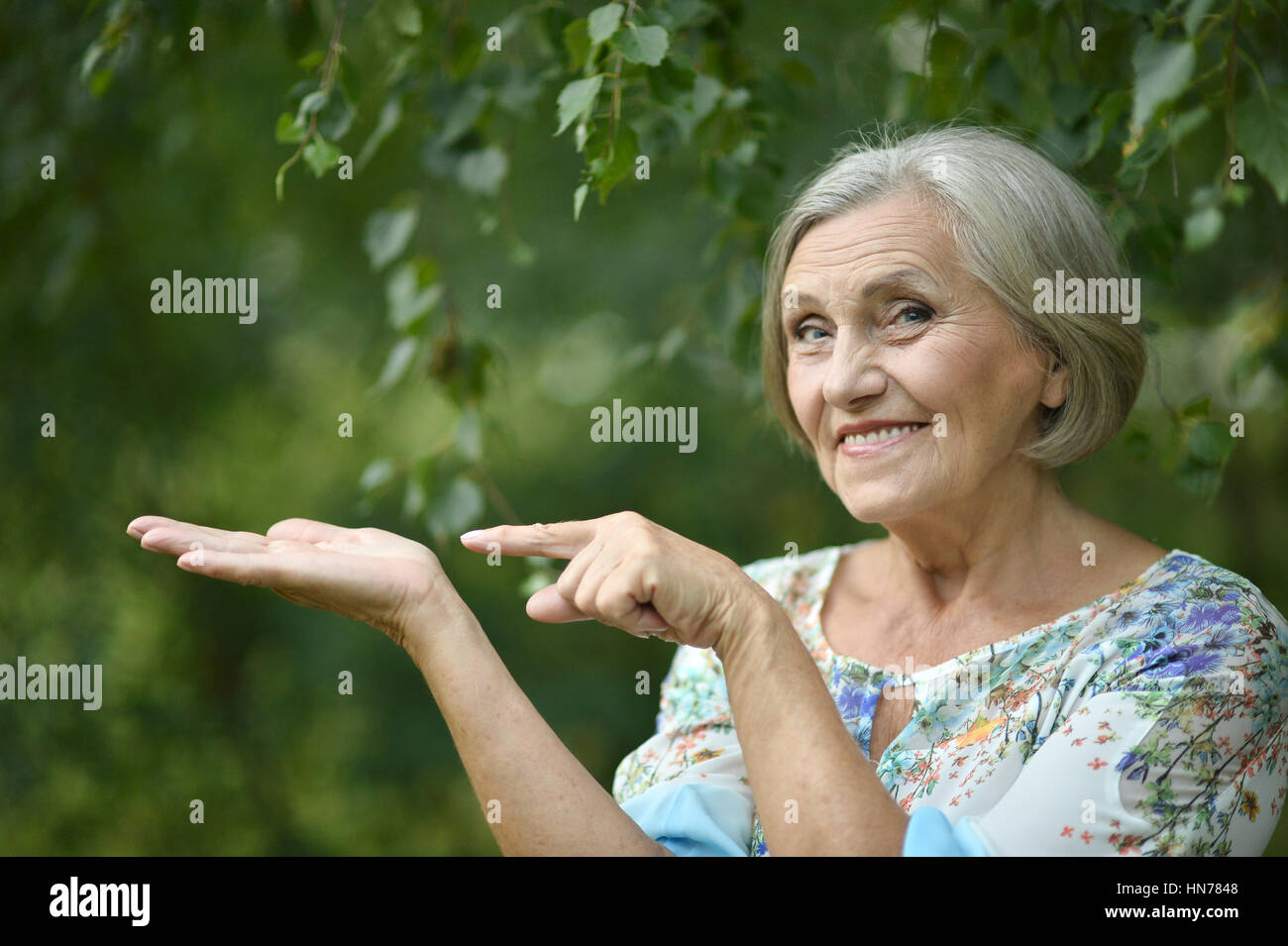 Older woman pointing Stock Photo - Alamy