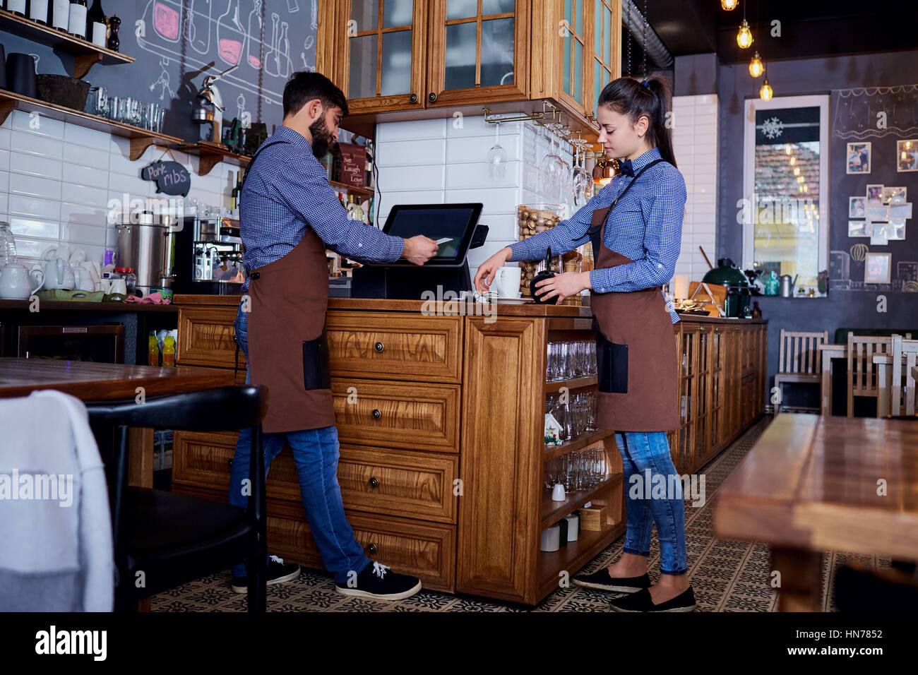 The bartender waiter working together in a bar workplace Stock Photo ...