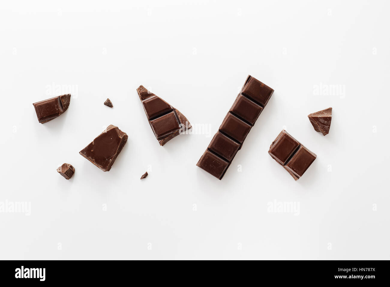 Chunks of Dark Chocolate On White Background Stock Photo - Alamy