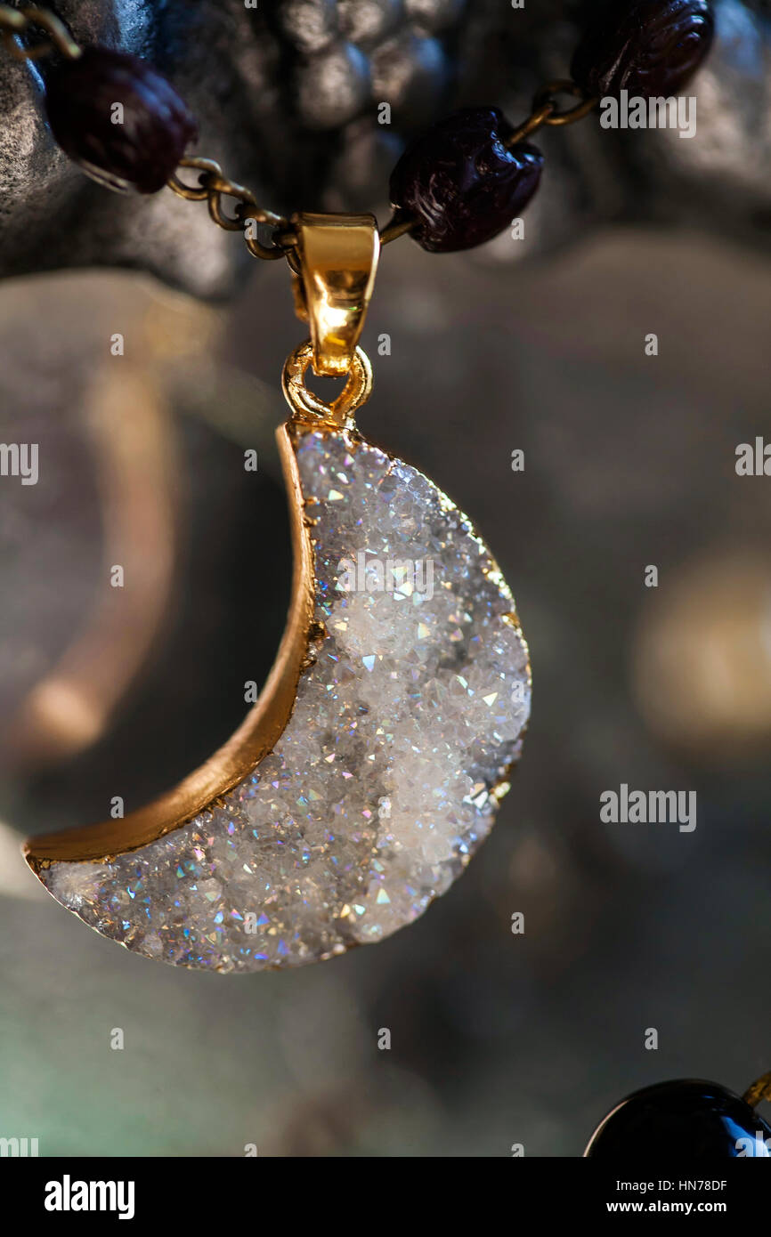 Beautiful natural stone pendant in moon shape Stock Photo - Alamy