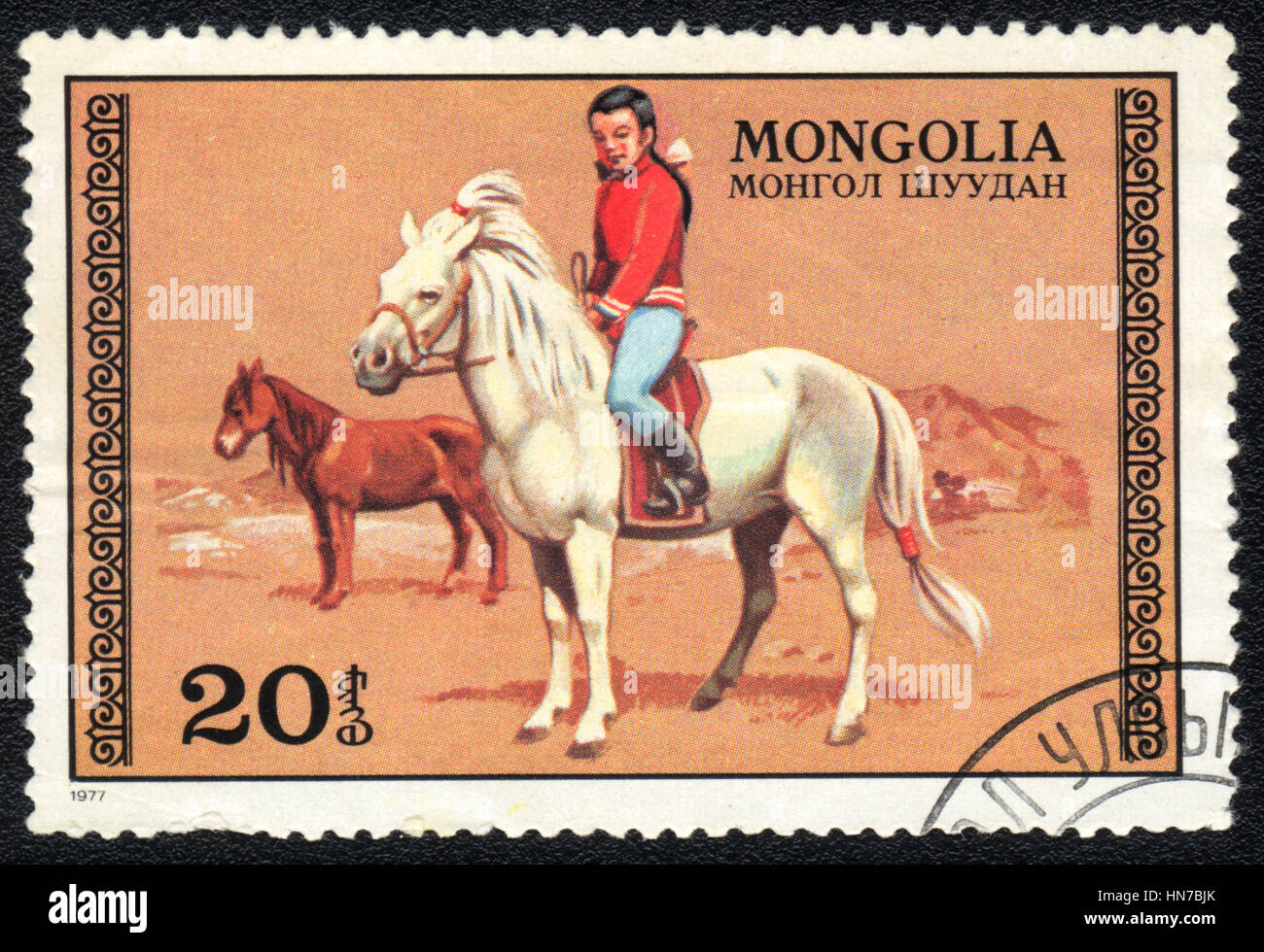 A postage stamp printed in Mongolia a Mongolian rider,1977 Stock Photo ...