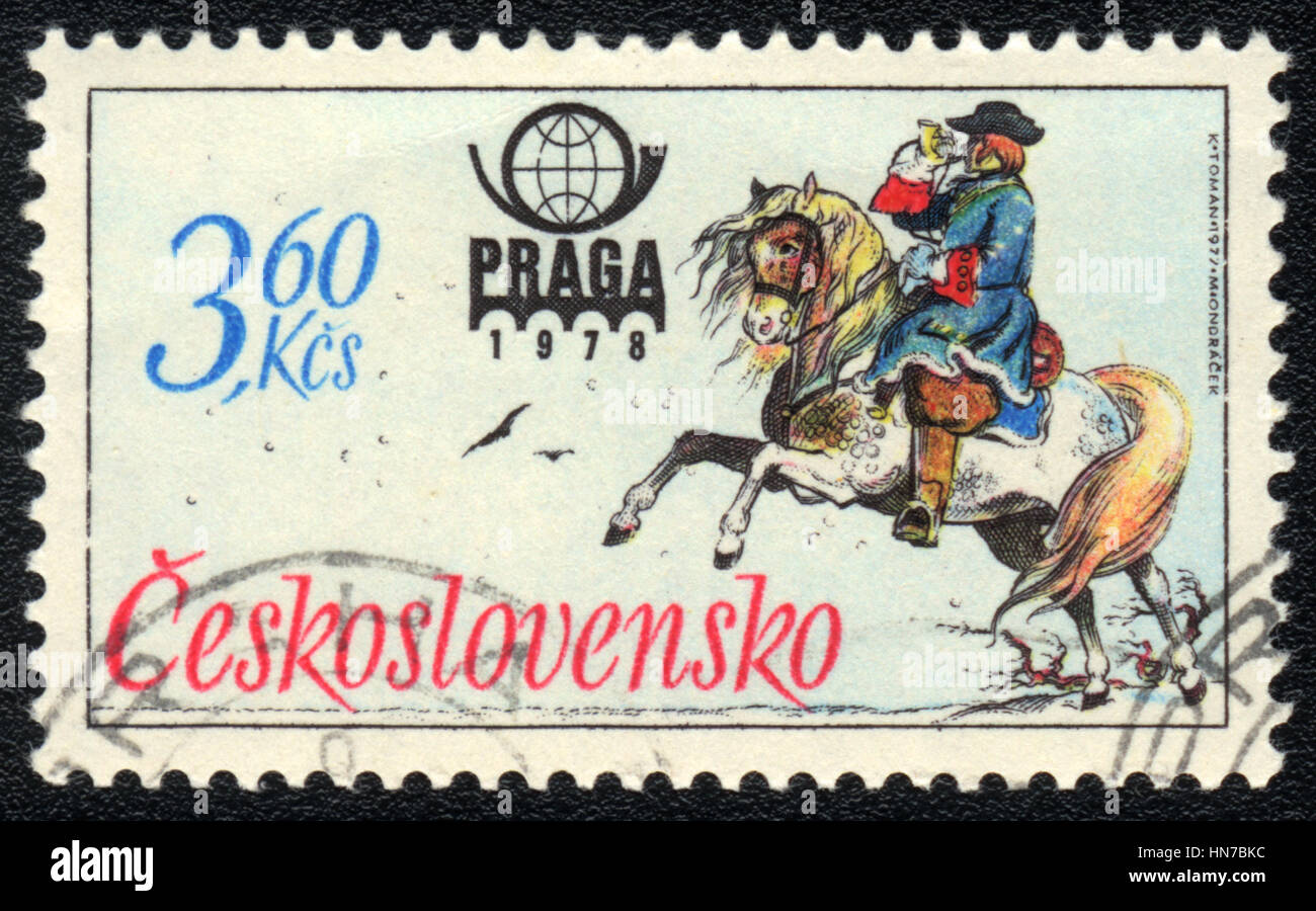 A postage stamp printed in Czechoslovakia shows a Rider with a horn ...