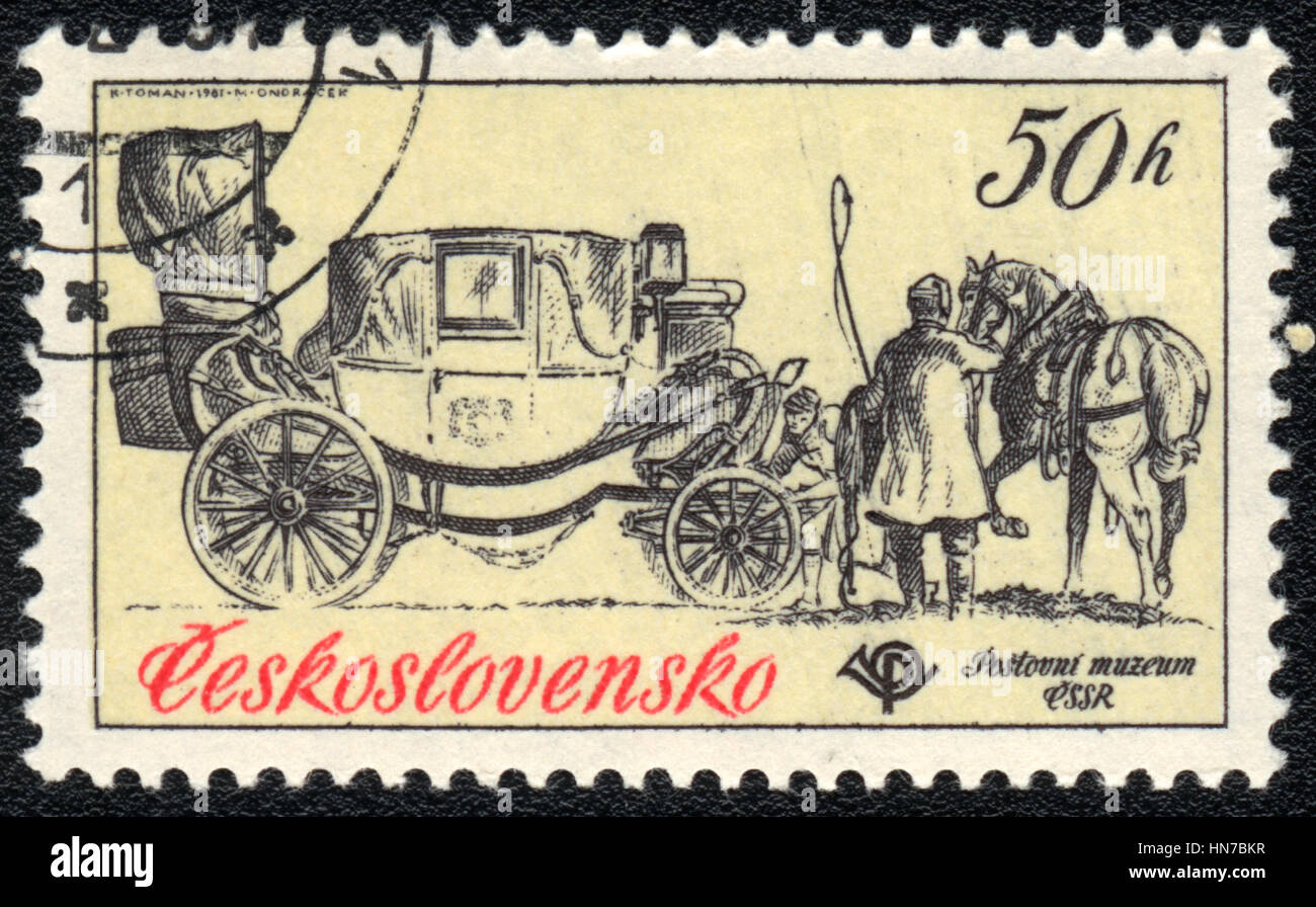 A postage stamp printed in Czechoslovakia shows a mail coach break ...
