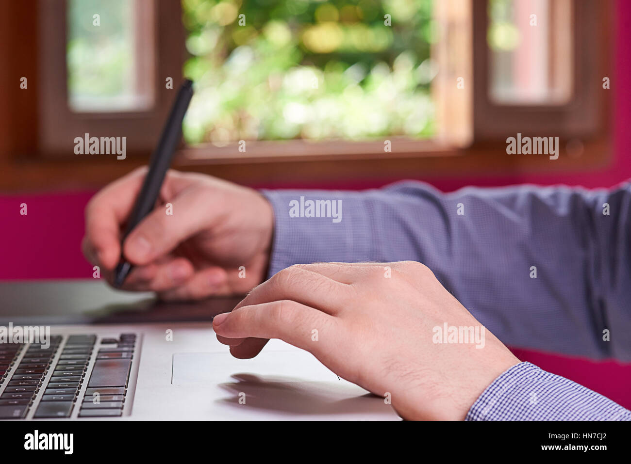 man creating sketch via lapton and tablet Stock Photo - Alamy