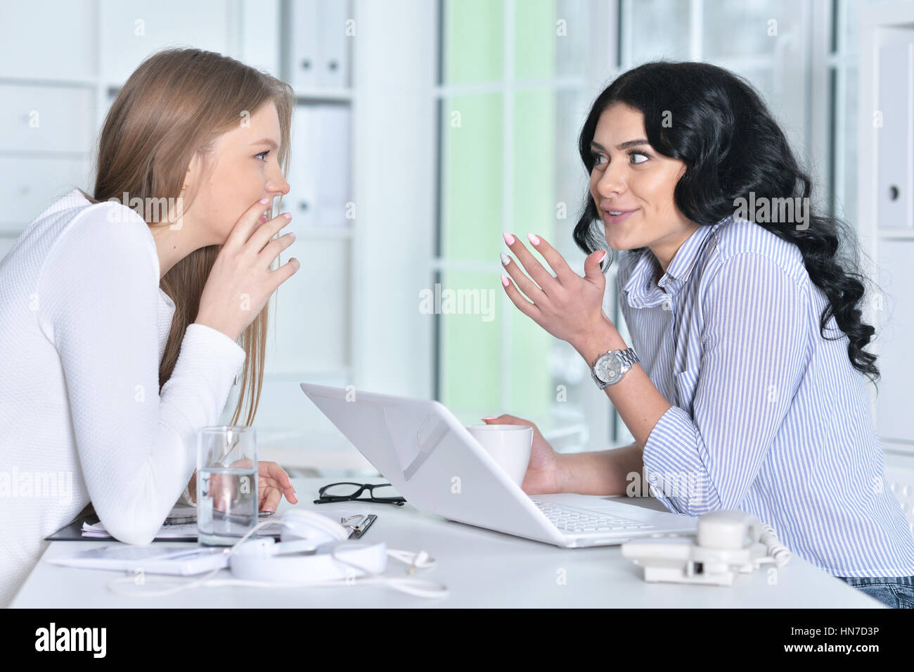 two young girls working Stock Photo - Alamy