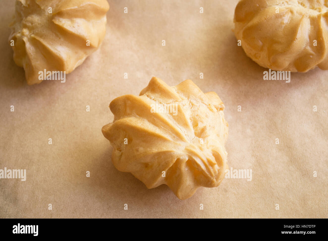 French eclairs on paper Stock Photo - Alamy