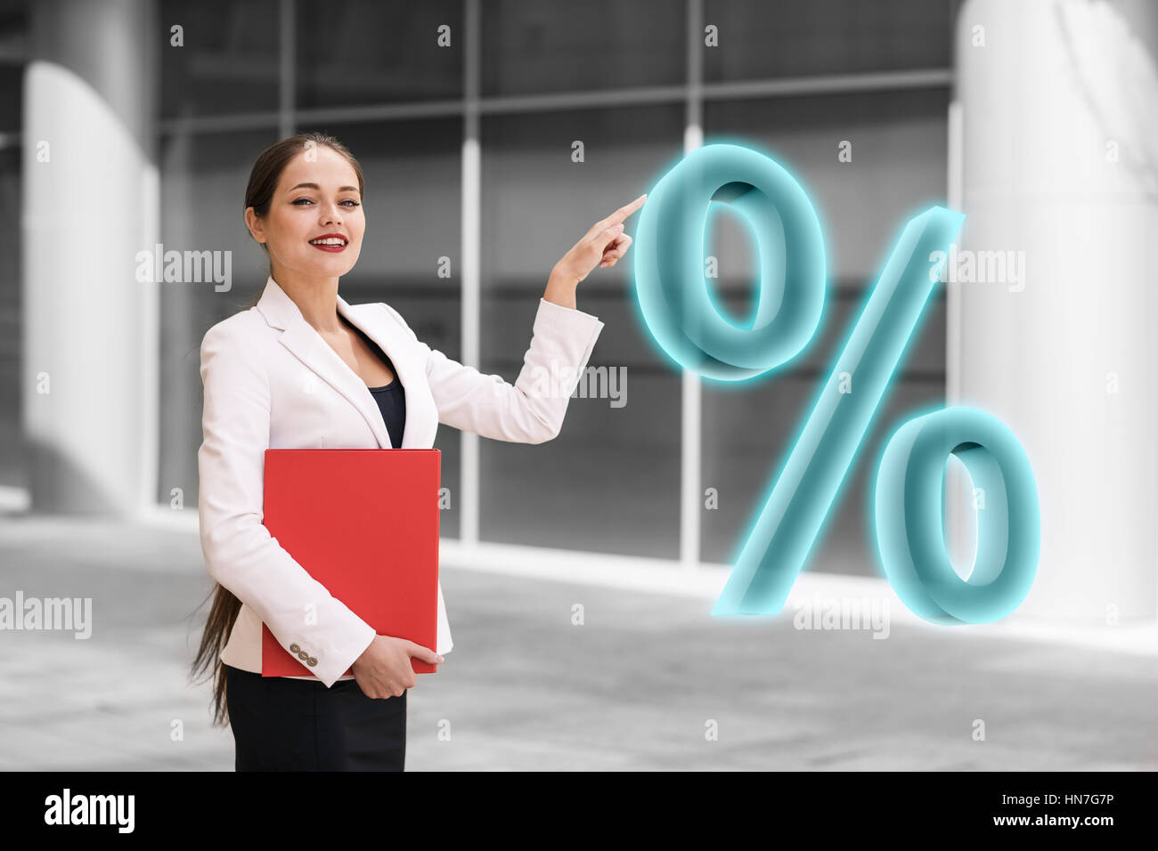 Businesswoman pushing big virtual percent Stock Photo - Alamy