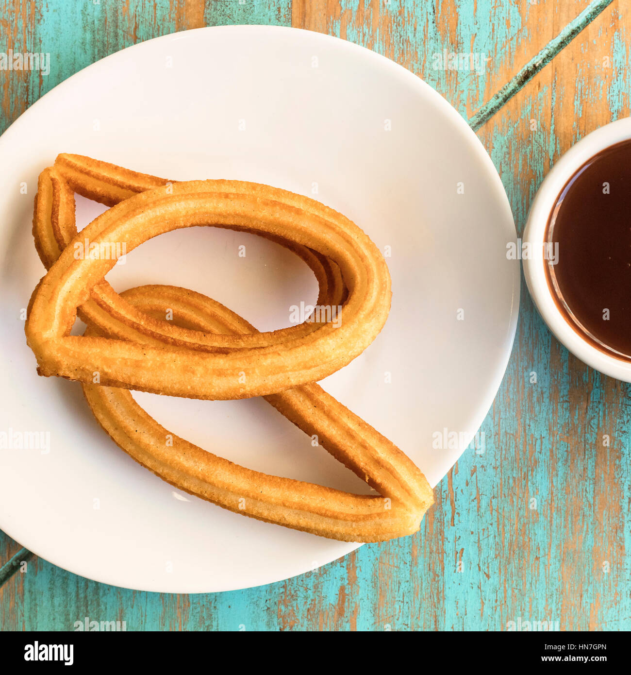 A square photo of a plate of churros, traditional Spanish, especially ...