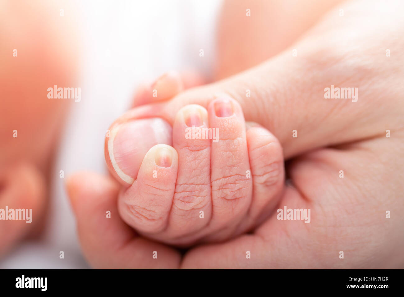 Infant grip hi-res stock photography and images - Alamy