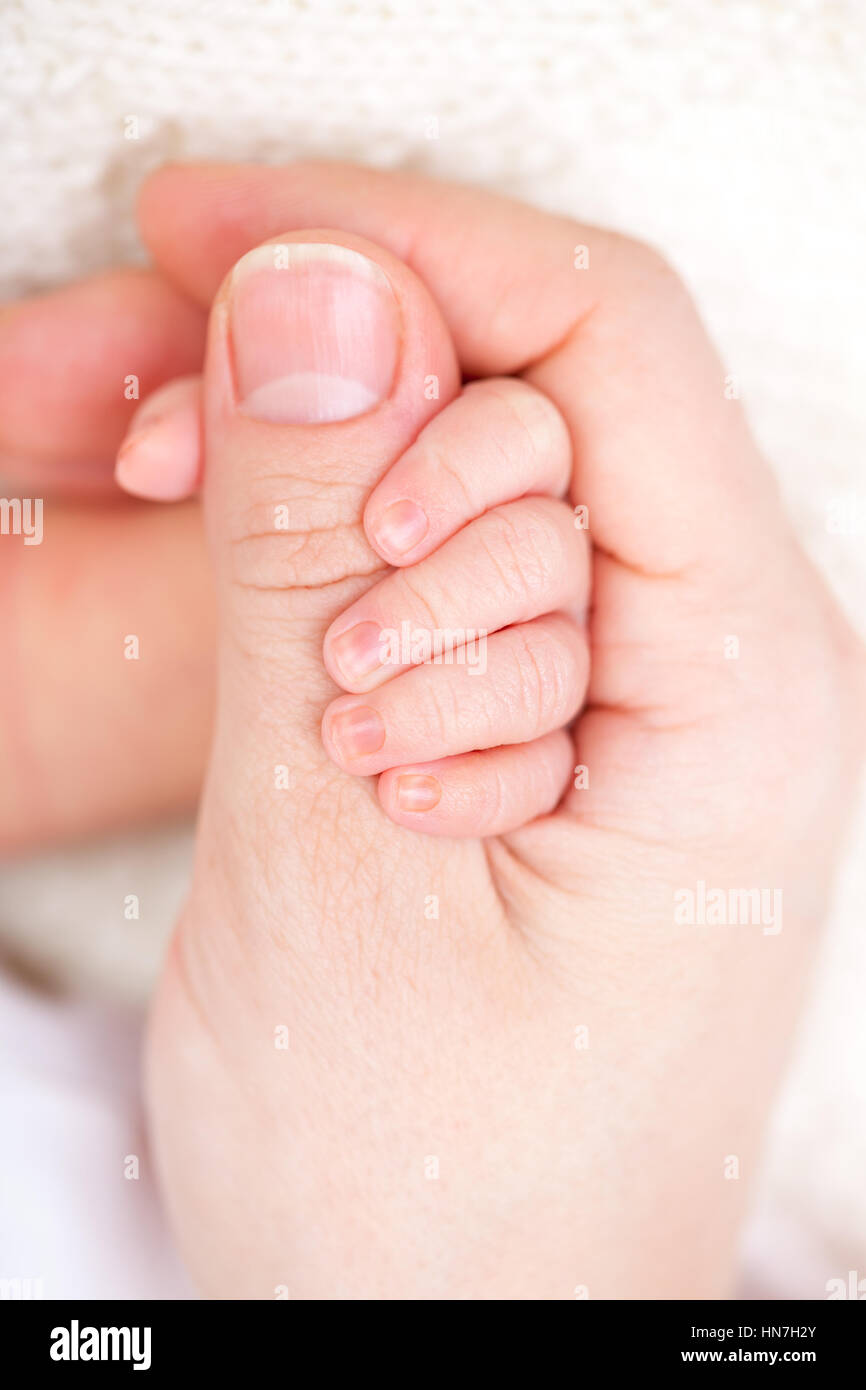 Baby hand grab hi-res stock photography and images - Alamy