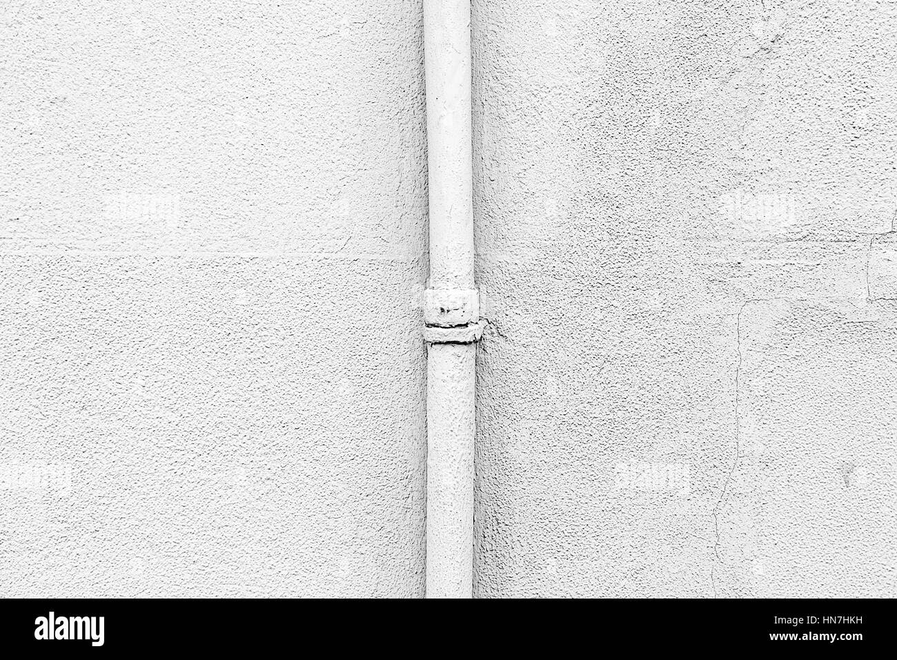 White wall with a pipe, detail of a textured wall Stock Photo - Alamy