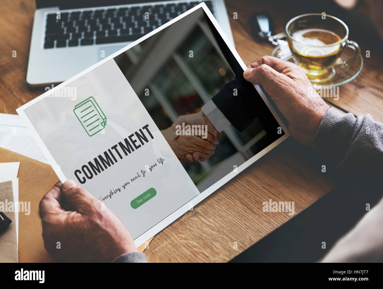 Commitment word on business handshake background Stock Photo - Alamy